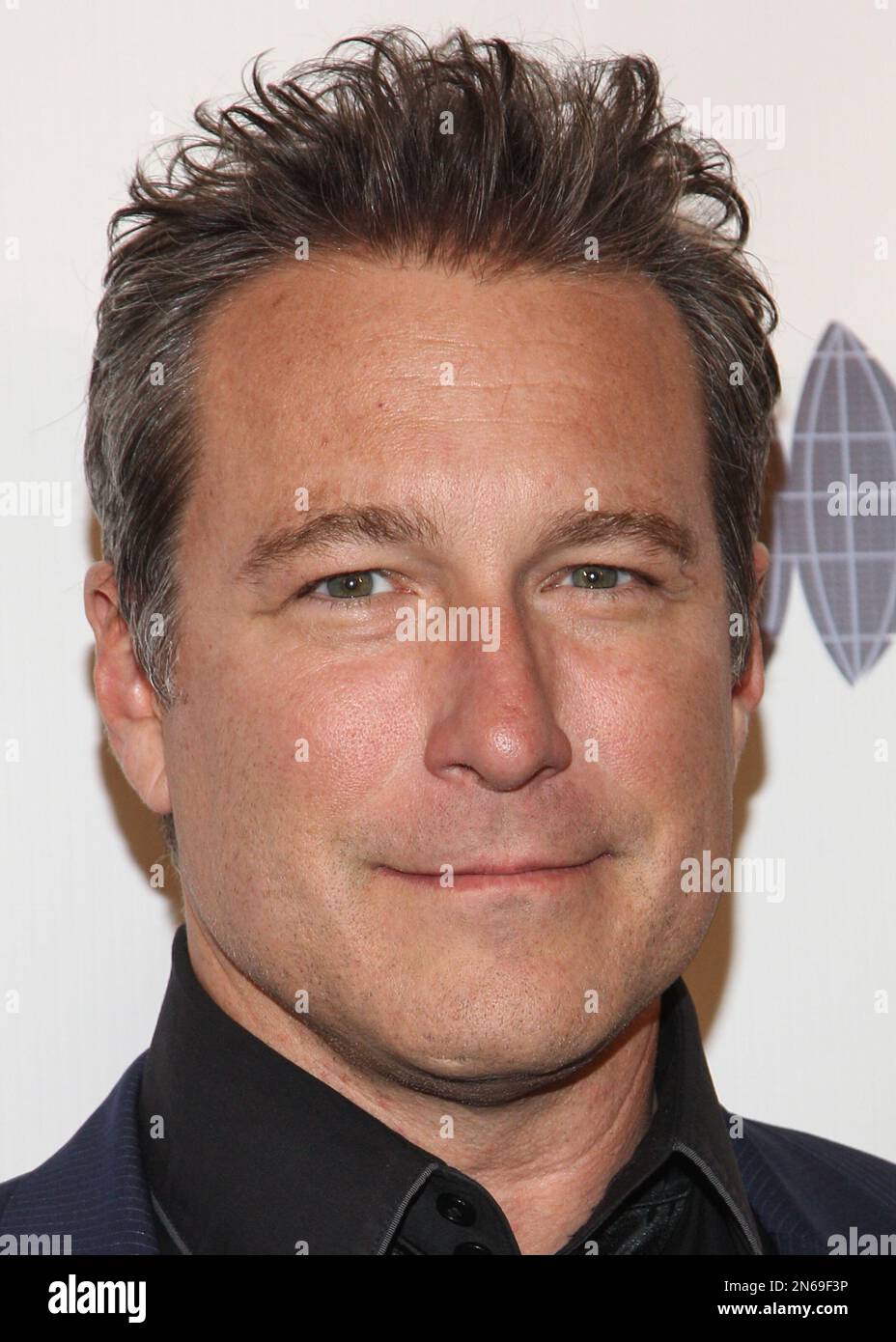 Actor John Corbett arrives at the International Women’s Media ...