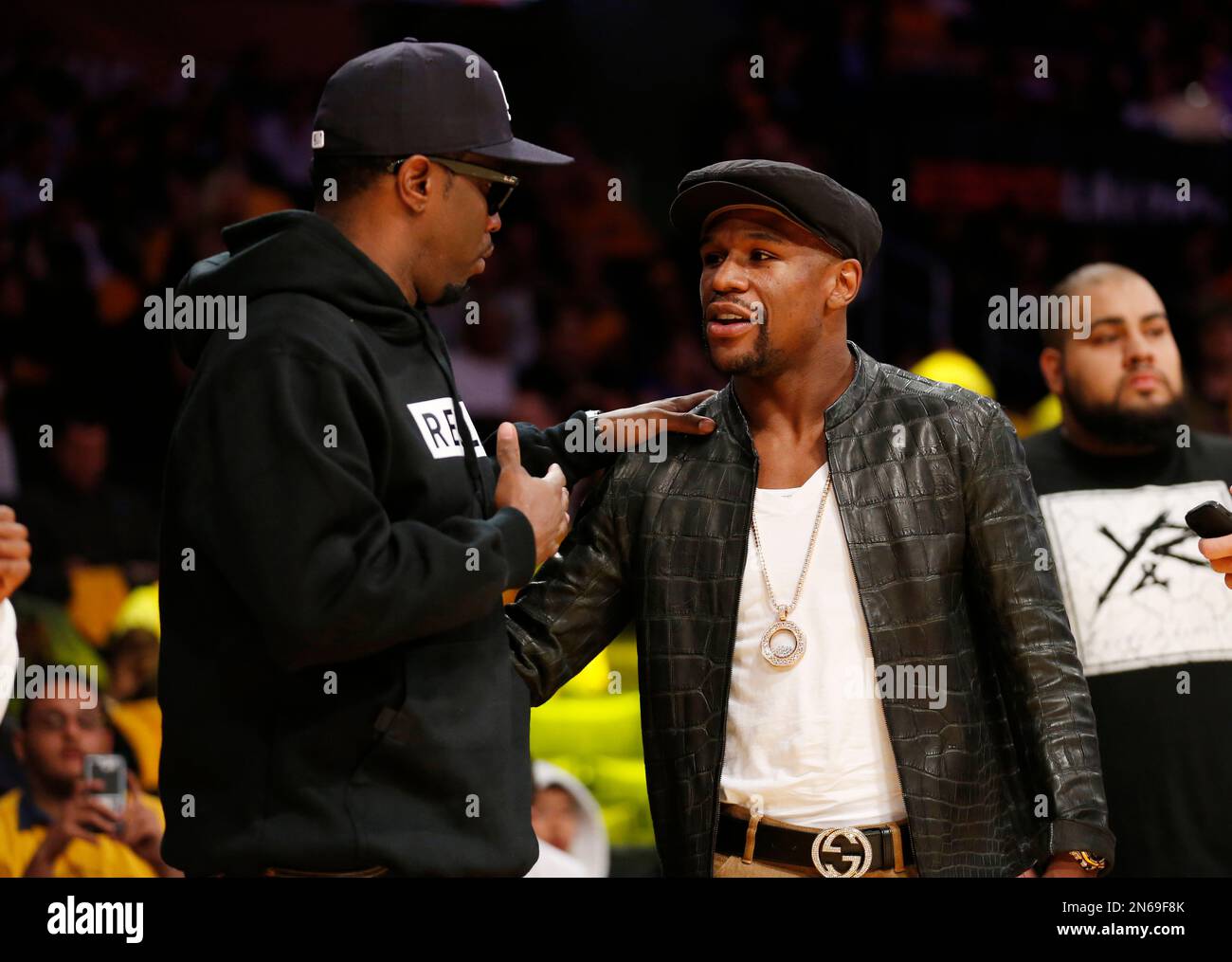 Recording artist Sean "Diddy" Combs, left, and boxer Floyd Mayweather ...