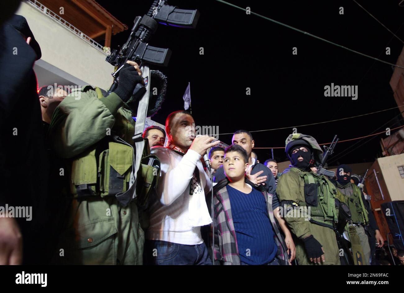 Released Palestinian prisoner Mohammed Sabbagh, center in white, is ...