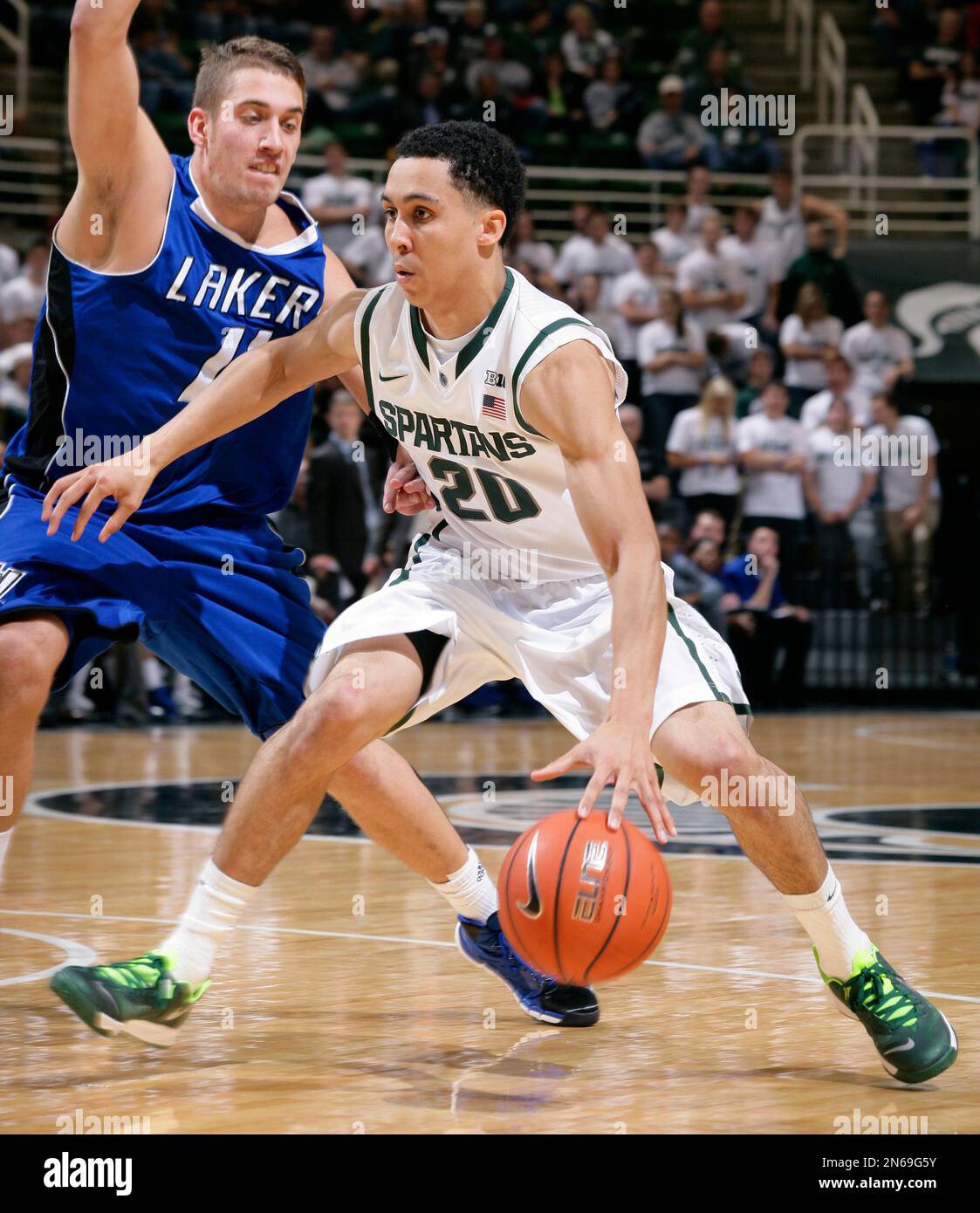 Michigan State's Travis Trice (20) drives against Grand Valley State's ...