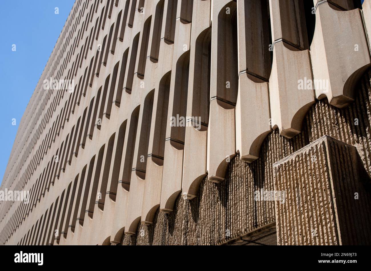 Architecture in brutalism style. Concrete building against sky Postwar ...
