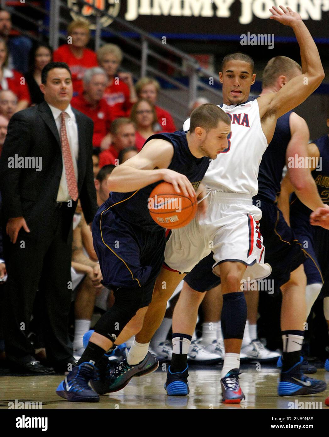 Augustana's Ben Shellim, left in front, dribbles pass the pressing ...