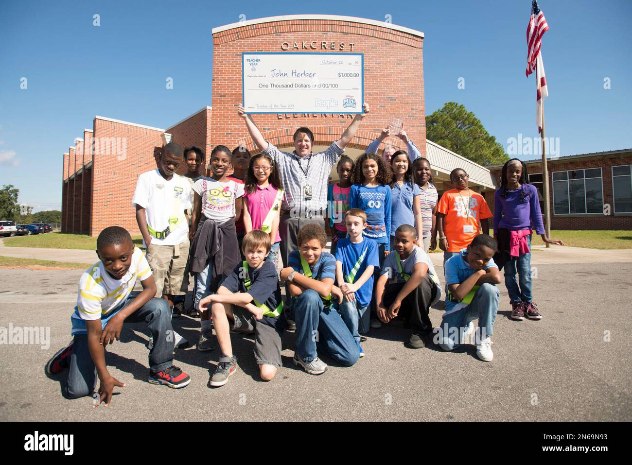 John Herber of Oakcrest Elementary School poses for pictures with ...