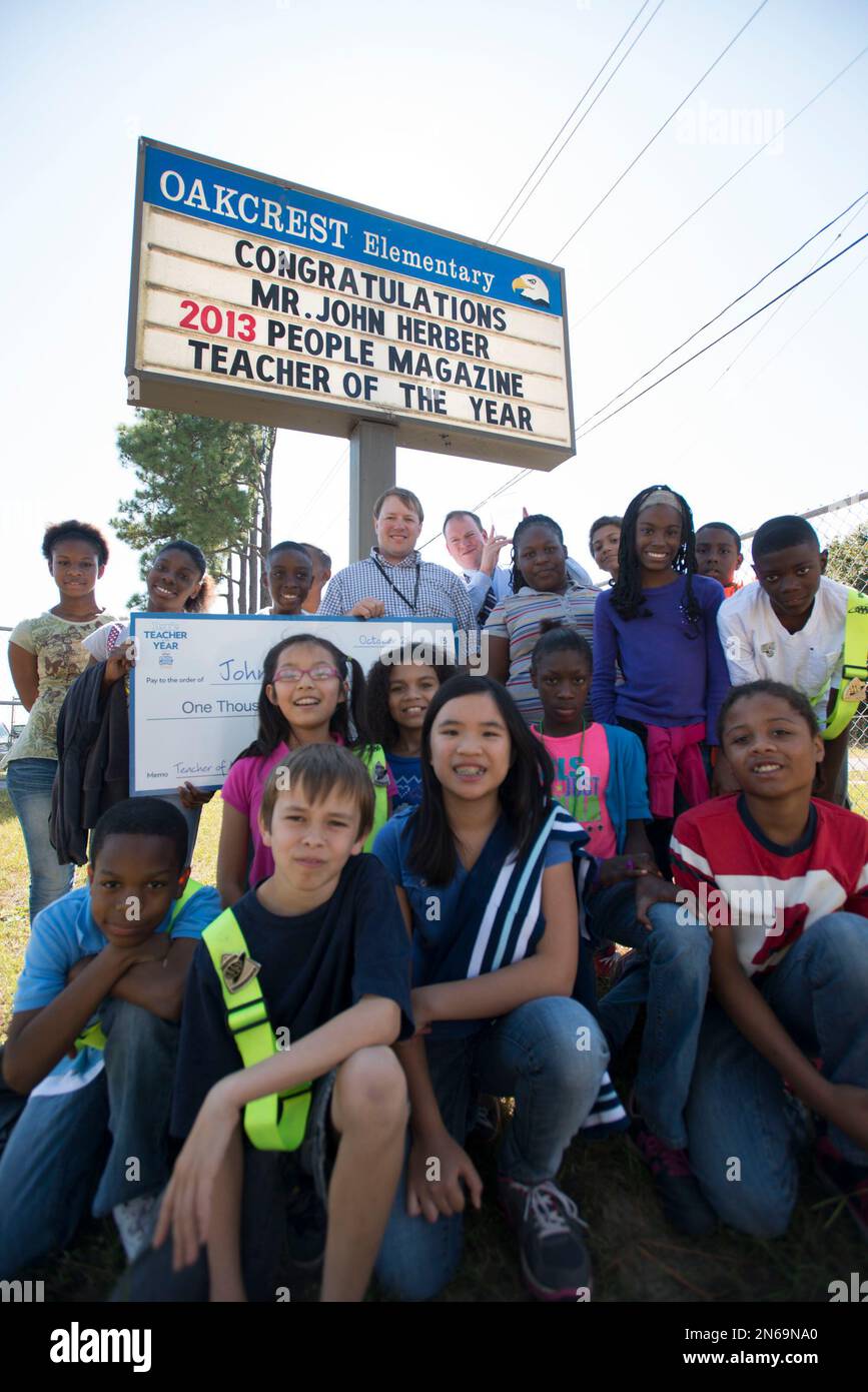 John Herber of Oakcrest Elementary School poses for pictures with ...