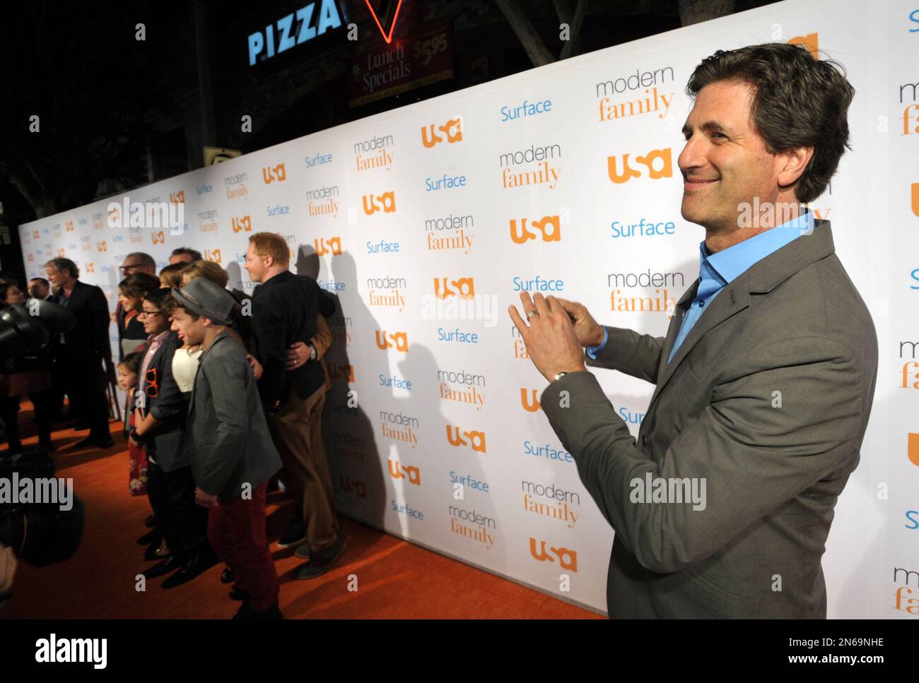 Steven Levitan, right, takes photographs on the red carpet at USA ...