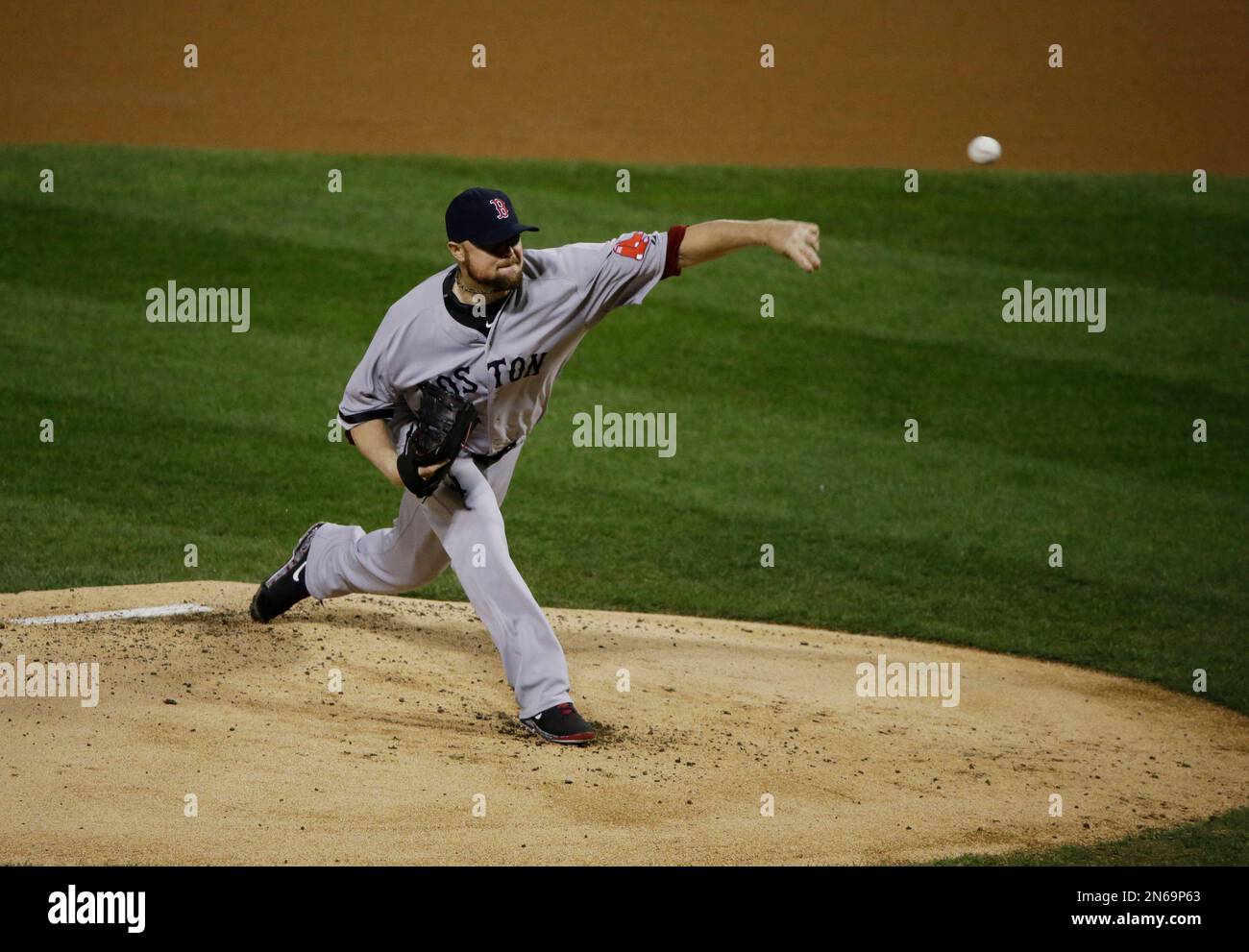 Boston Red Sox starting pitcher Jon Lester winds up to throw during the ...