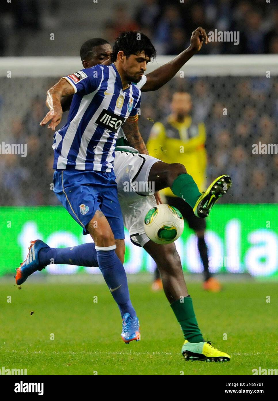 FC Porto's Lucho Gonzalez, front, from Argentina challenges Sporting's ...