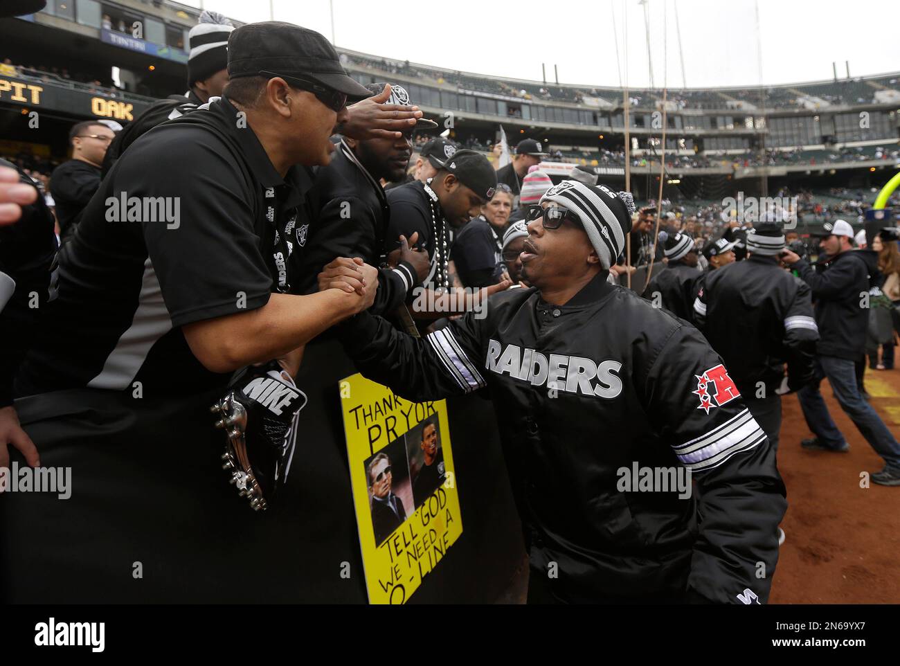 Musician MC Hammer, right, greets fans at O.co Coliseum before an NFL ...