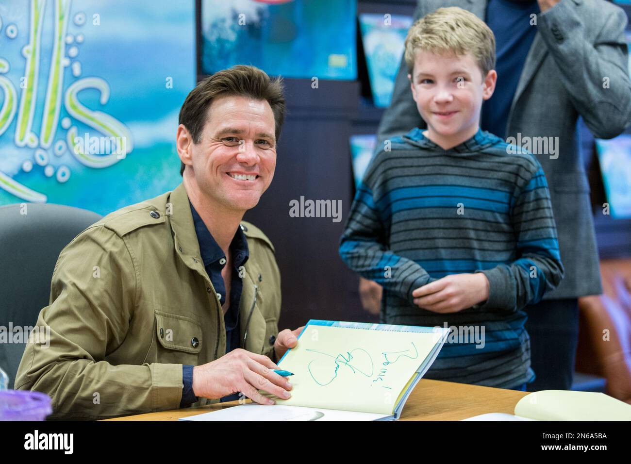 Jim Carrey signs his children's book "How Roland Rolls" at the Barnes ...