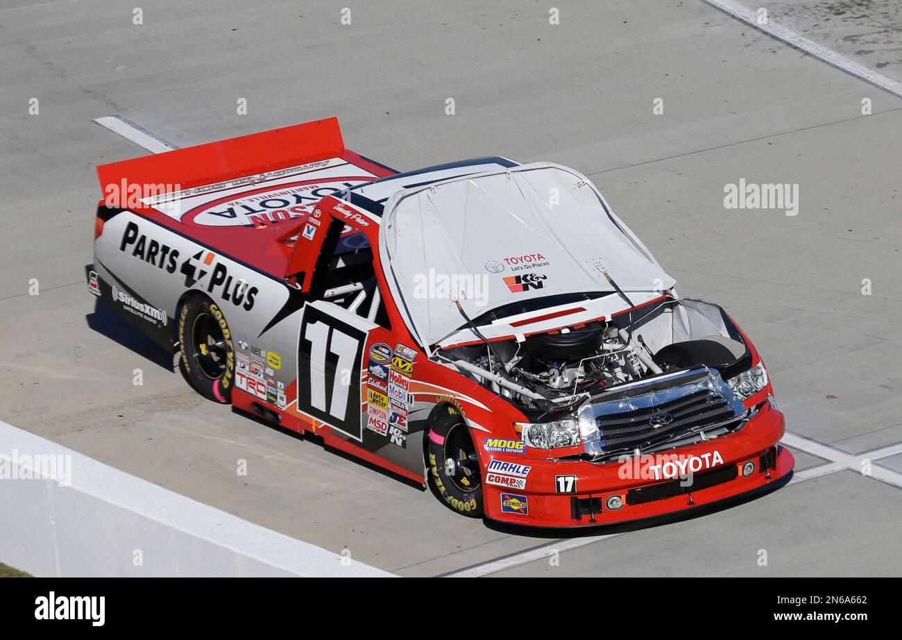 Timothy Peters (17) tries to find his pit stall after his hood flip up ...