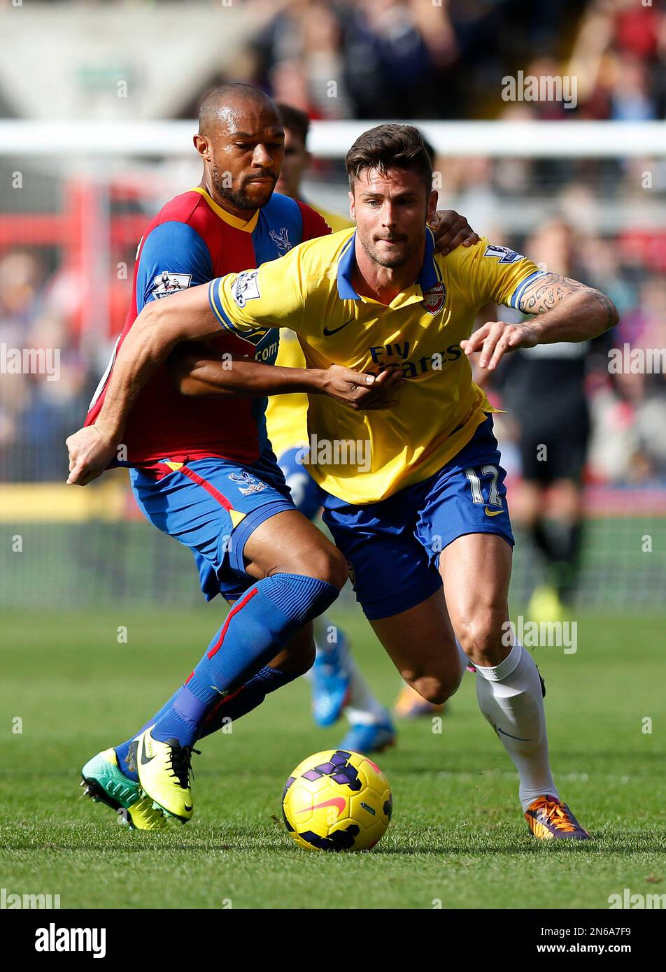 Crystal Palace's Daniel Gabbidon, left, competes with Arsenal's Olivier ...