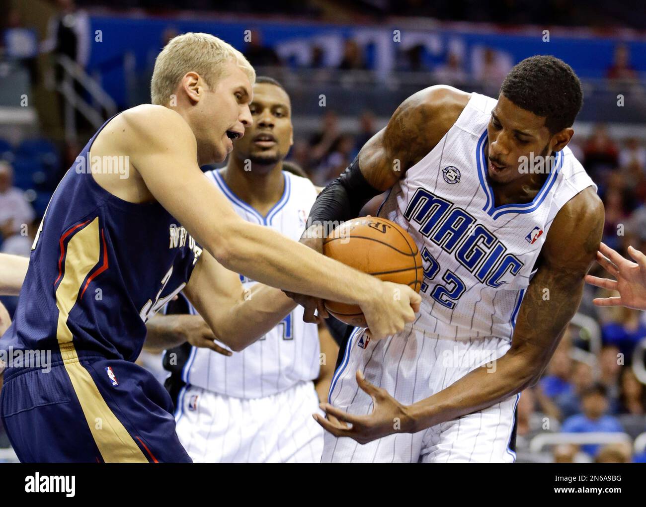 New Orleans Pelicans' Greg Stiemsma, left, battles for a loose ball ...
