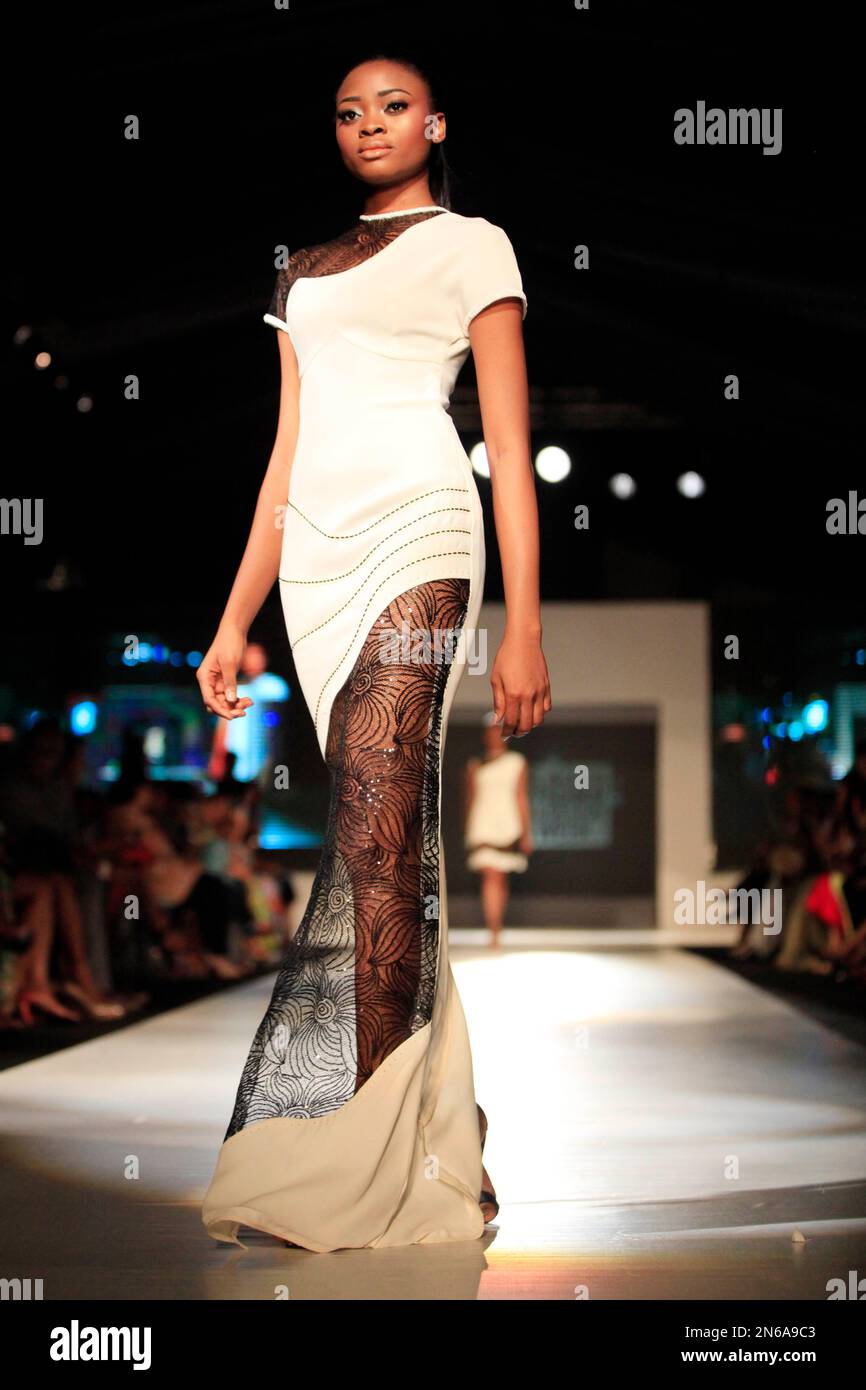A model displays an outfit by designer Iconic Ivanity during the Lagos ...