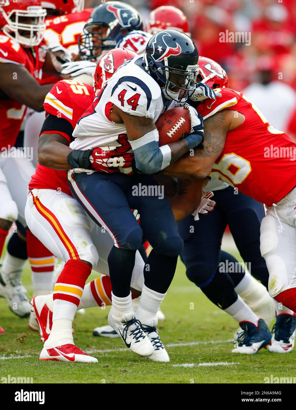 Houston Texans running back Ben Tate (44) is tackled by Kansas City ...