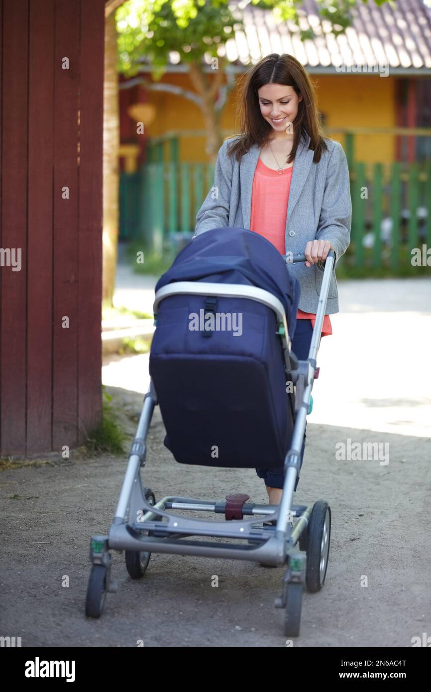 Pushing a stroller for a walk hi-res stock photography and images - Alamy