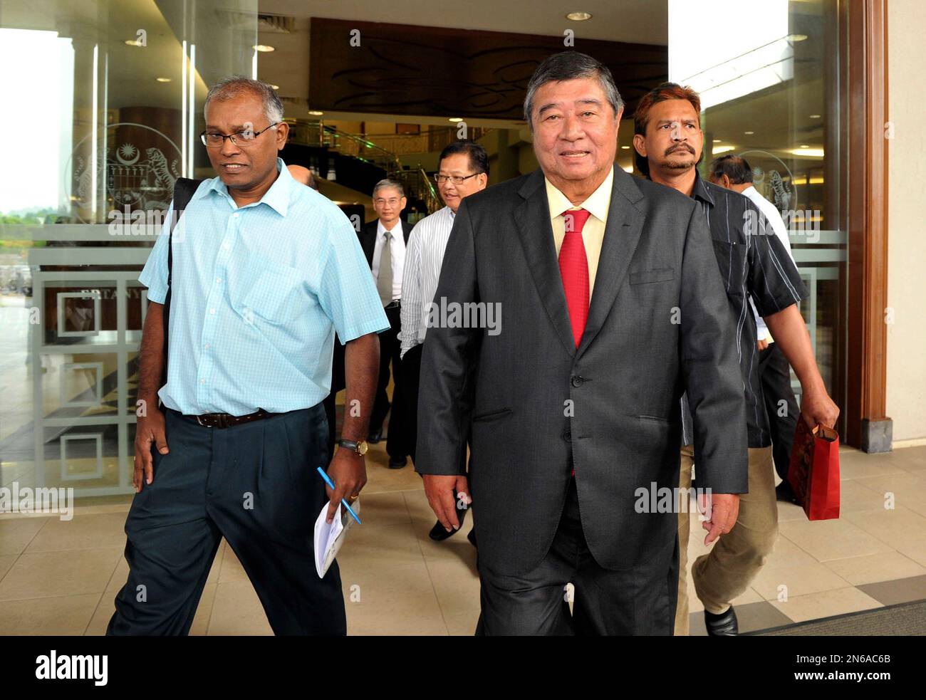 Former Malaysian Transport Minister Ling Liong Sik, right, leaves a ...