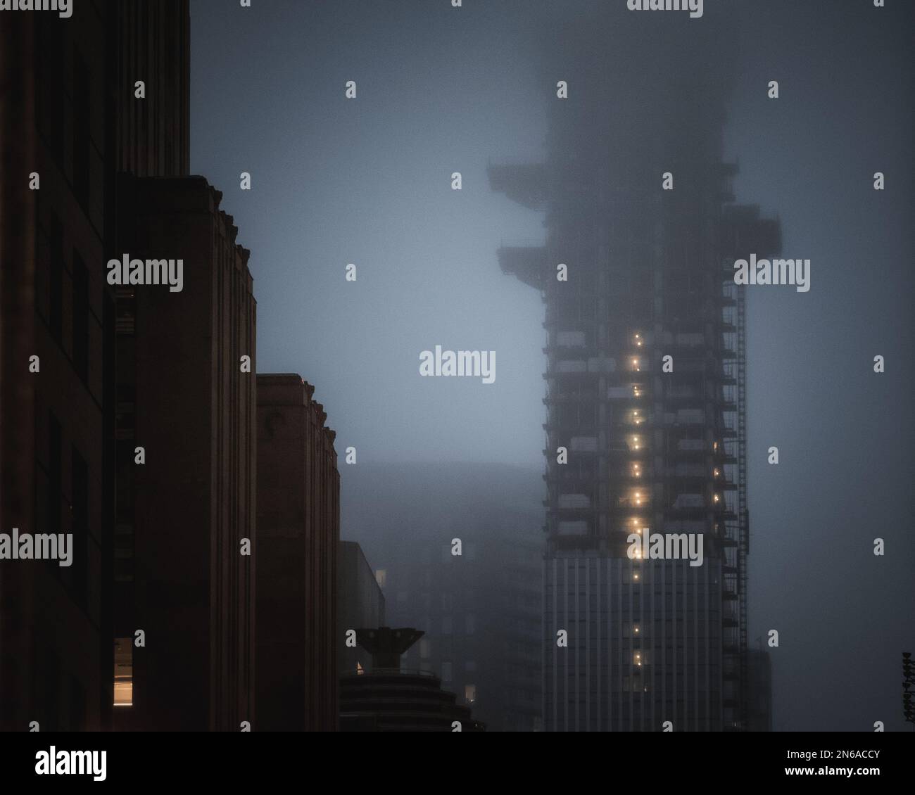 Foggy city at night Stock Photo - Alamy