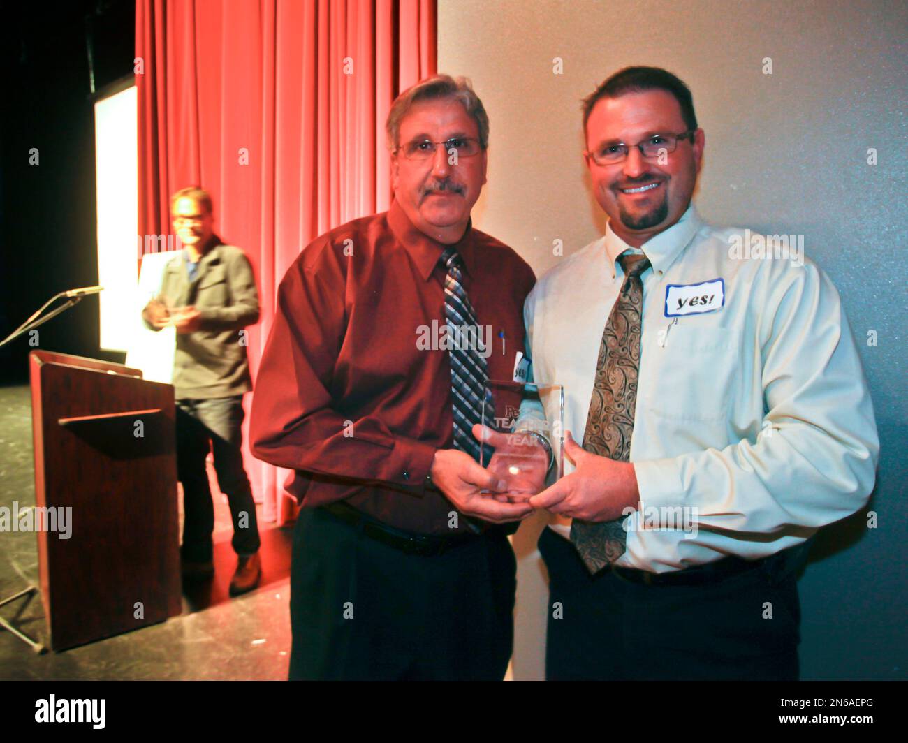 David Hamilton, left, and Sean O'Donnell hold a glass trophy that ...
