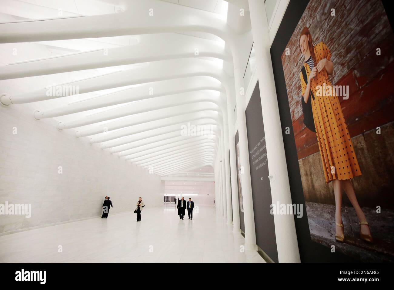 People enter the newly opened commuter concourse, an underground ...