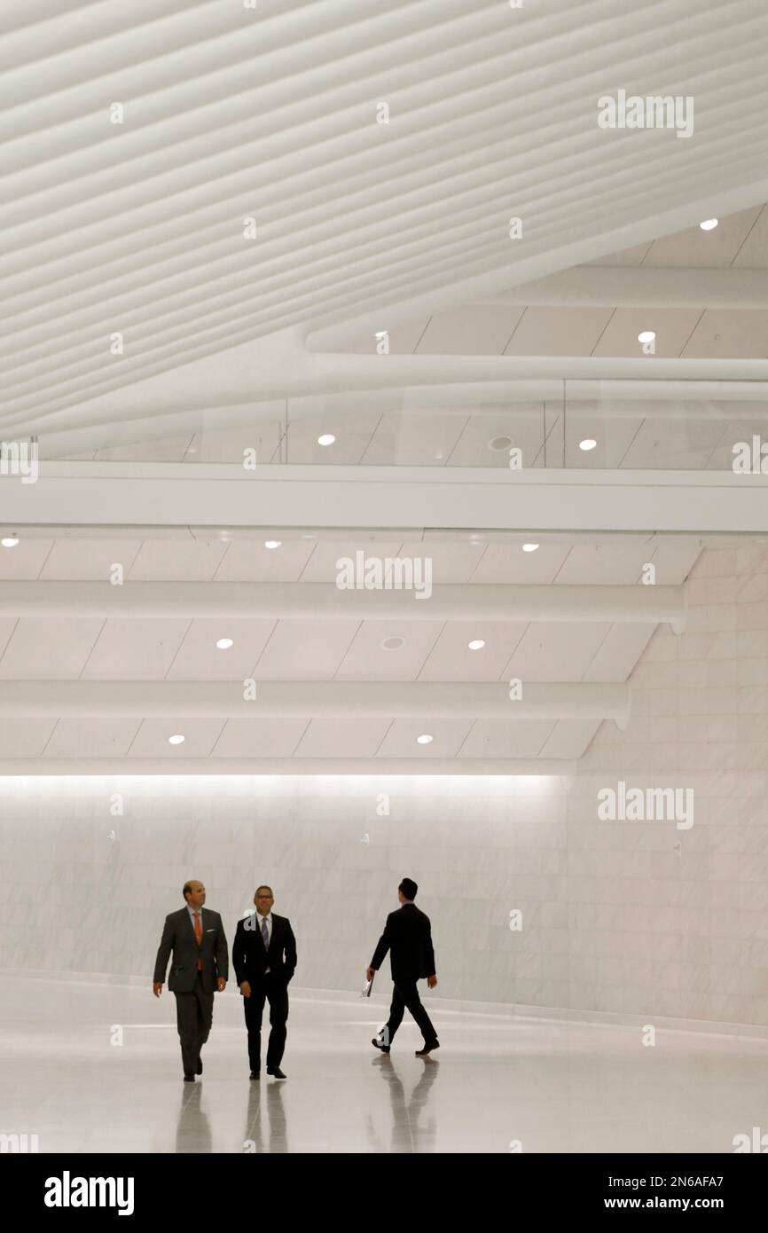 People enter the newly opened commuter concourse, an underground ...