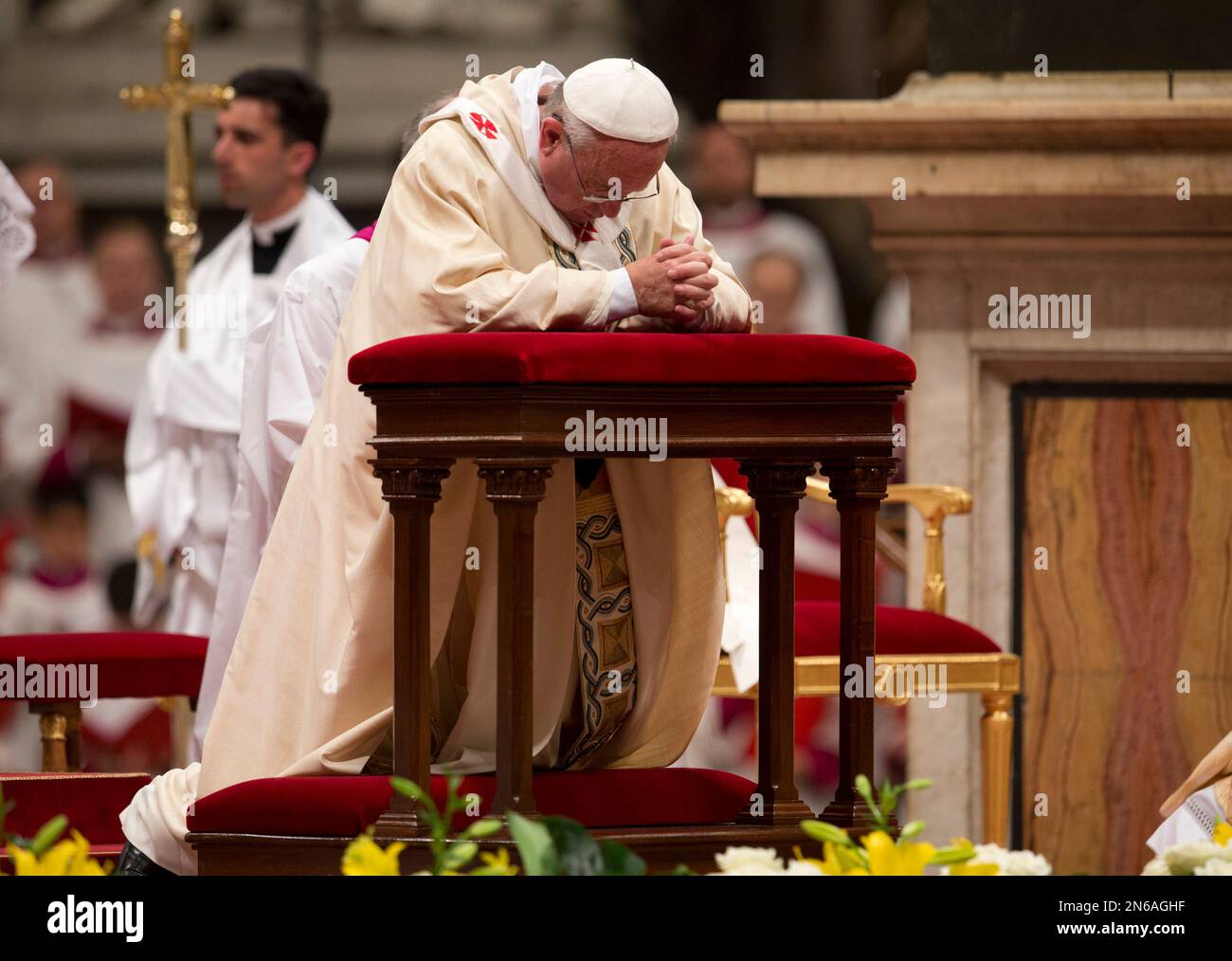 Pope Francis prays as he celebrates a ceremony to ordain new bishops ...