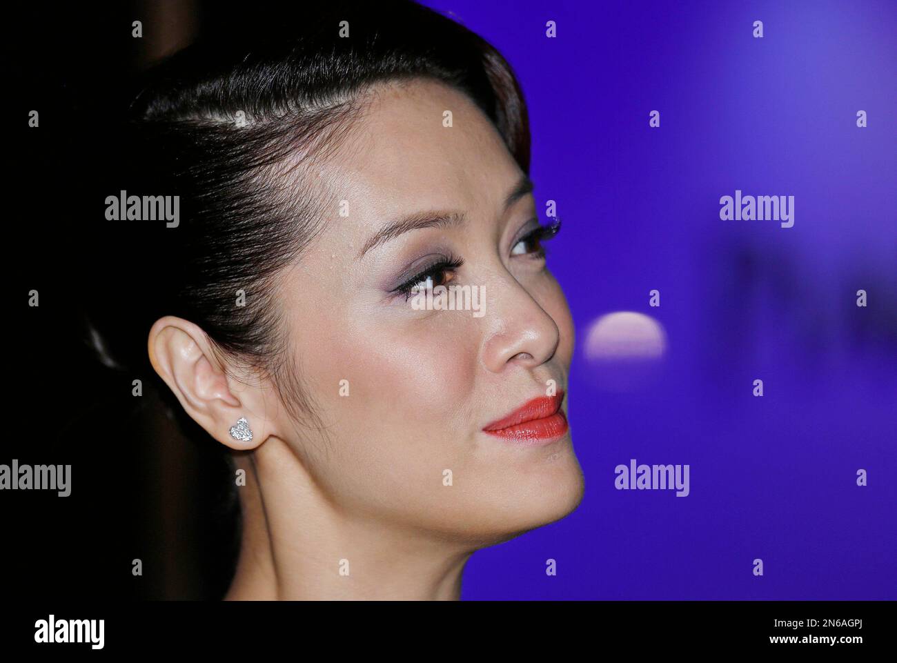 Hong Kong actress Anne Heung poses for photographers during a ...