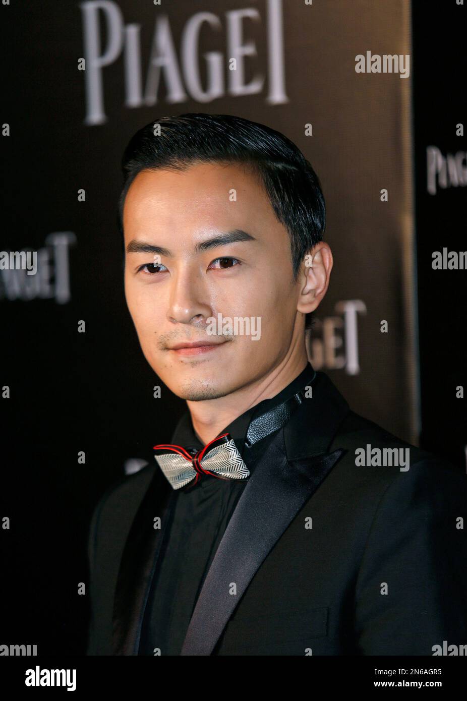 Taiwanese actor Joseph Cheng poses for photographers during a ...