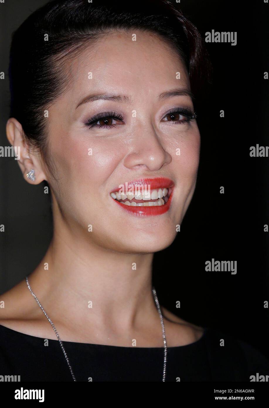 Hong Kong actress Anne Heung poses for photographers during a ...