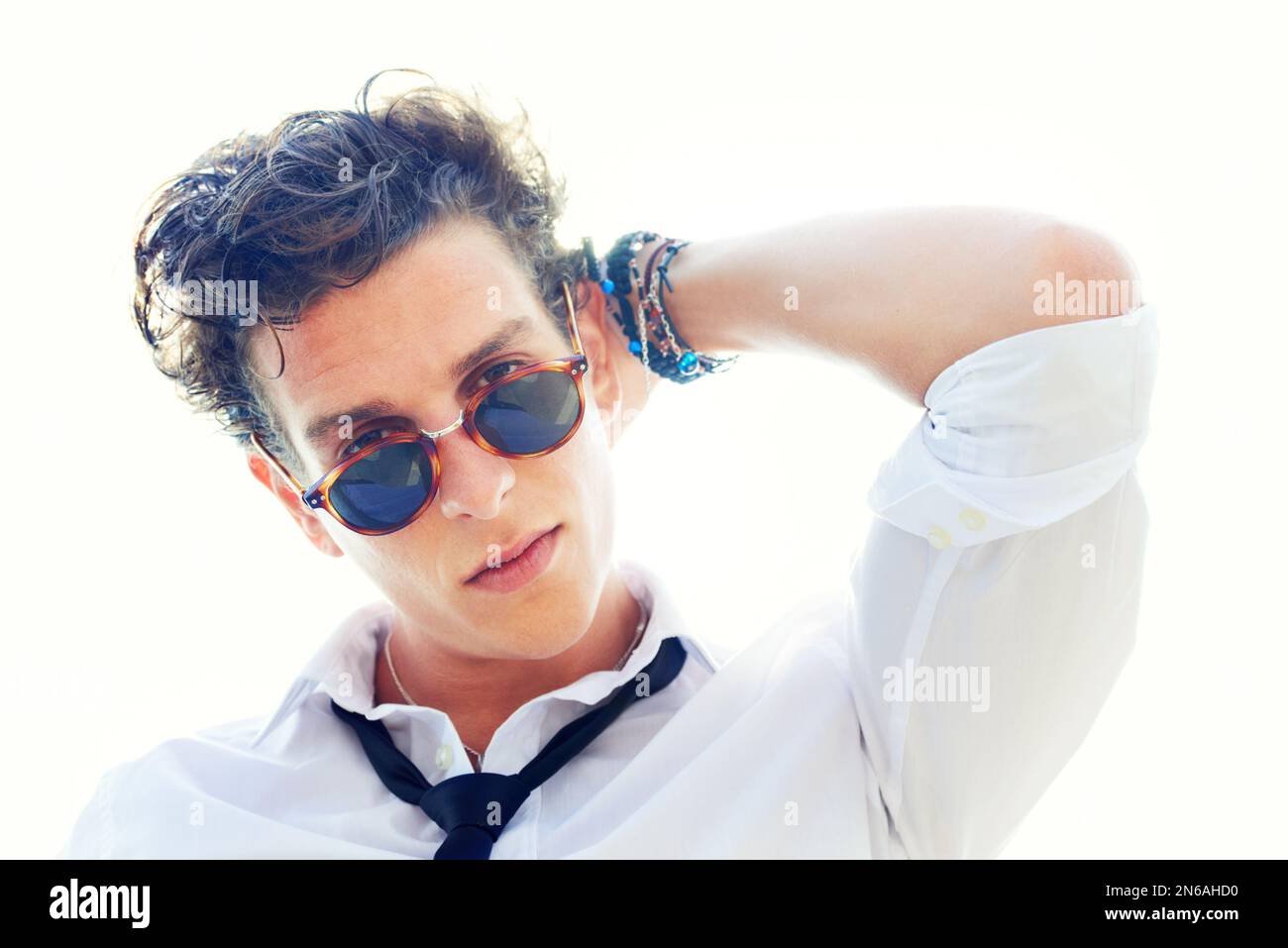 Quiet masculine style. Low angle portrait of a handsome and stylish ...