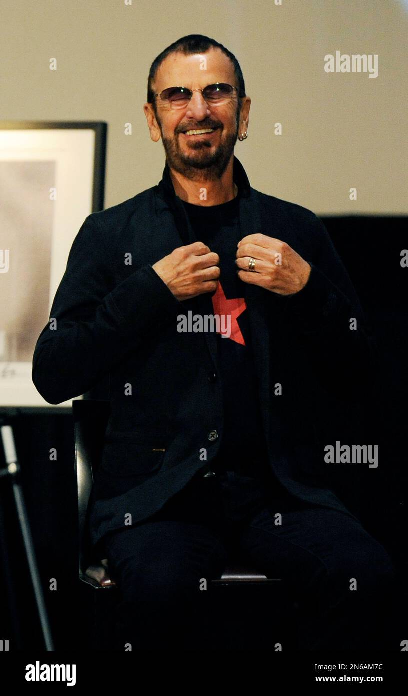 Ringo Starr smiles from the stage during the unveiling of "PHOTOGRAPH ...