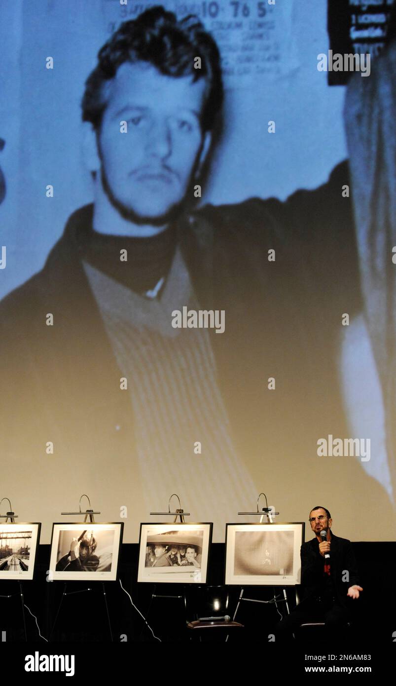 Ringo Starr speaks underneath an early photo of himself at the ...