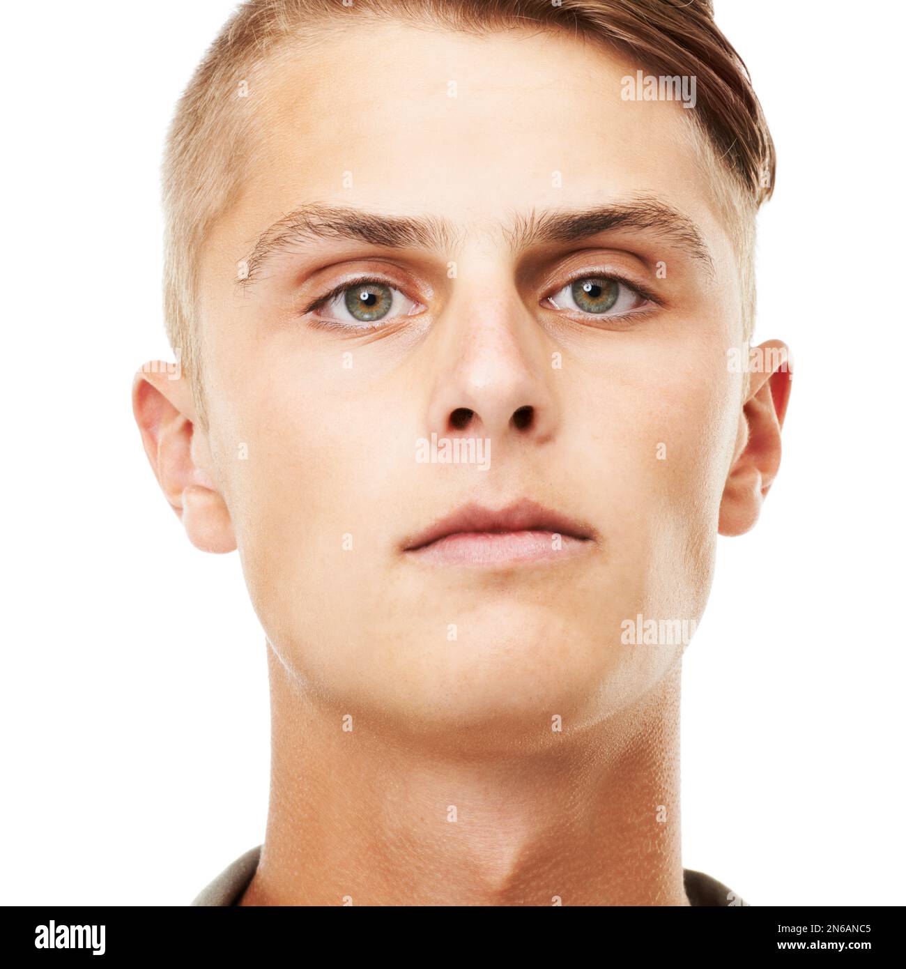 Expressionless style. A closeup portrait of a serious looking young man ...