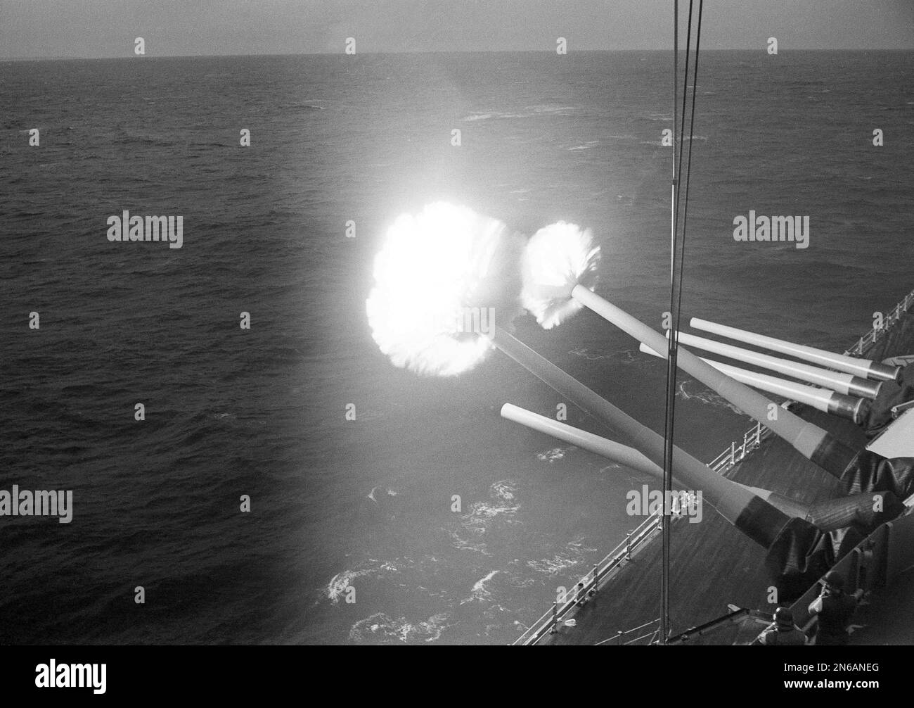The 16-inch guns on the bow of the battleship New Jersey fire at North ...