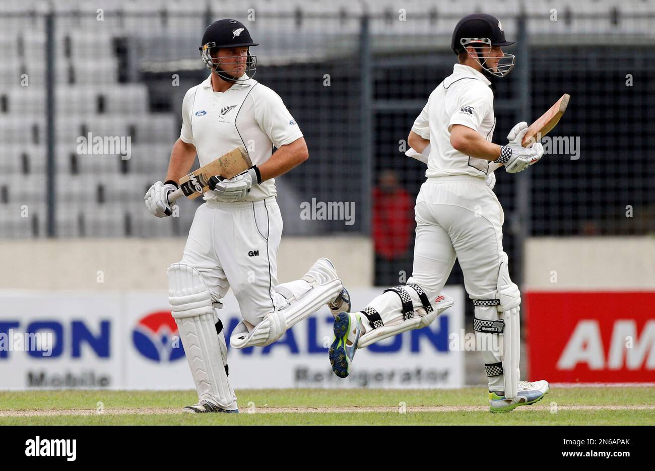 New Zealand’s Kane Williamson, right, and Corey Anderson run between ...