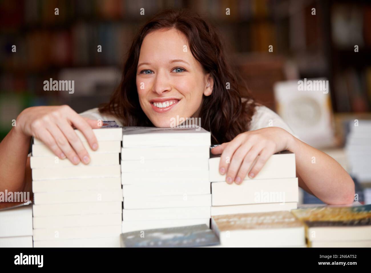 Ill take them all, thank you. Portrait of a young woman leaning over ...