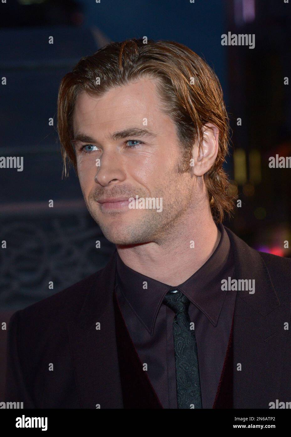 Actor Chris Hemsworth poses for photographers on the red carpet as he ...