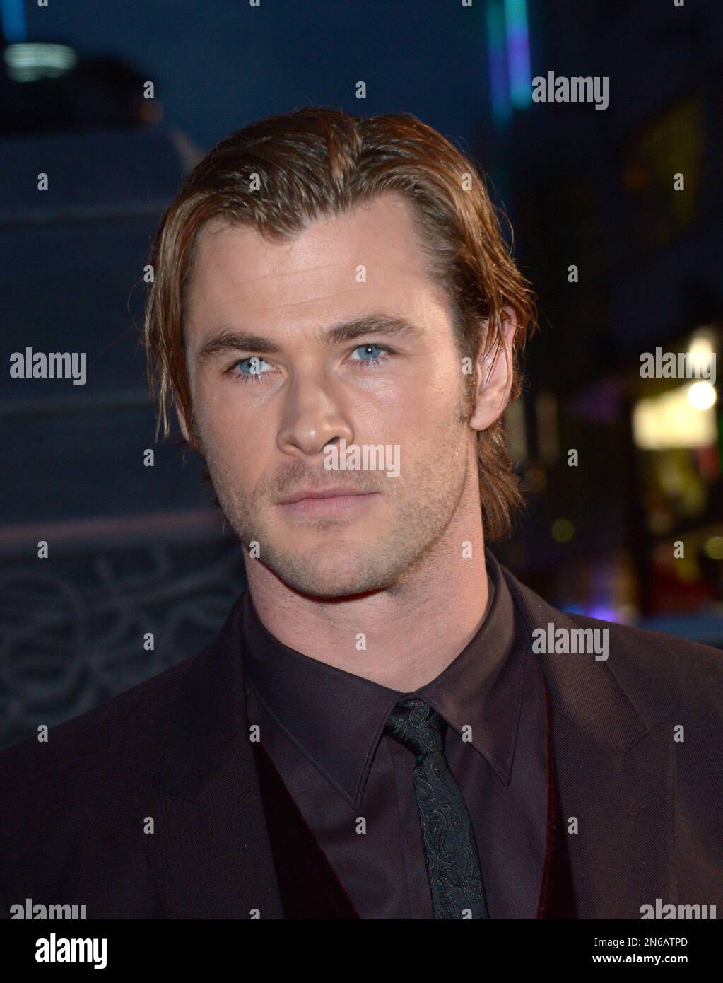 Actor Chris Hemsworth poses for photographers on the red carpet as he ...
