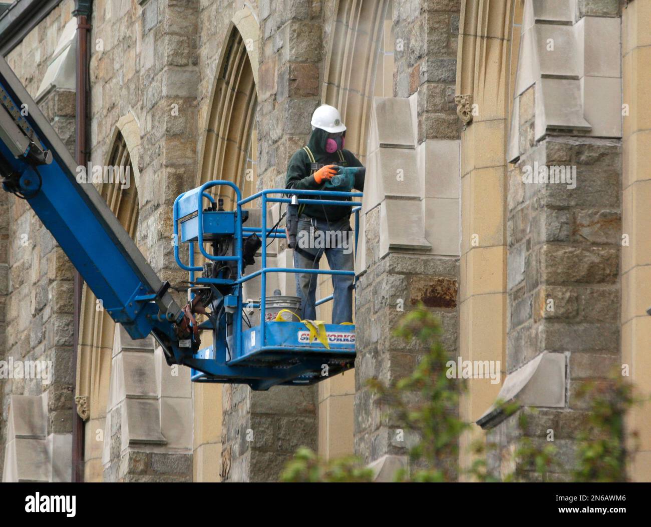 Monty Montgomery performs masonry maintenance work on St. Francis of ...