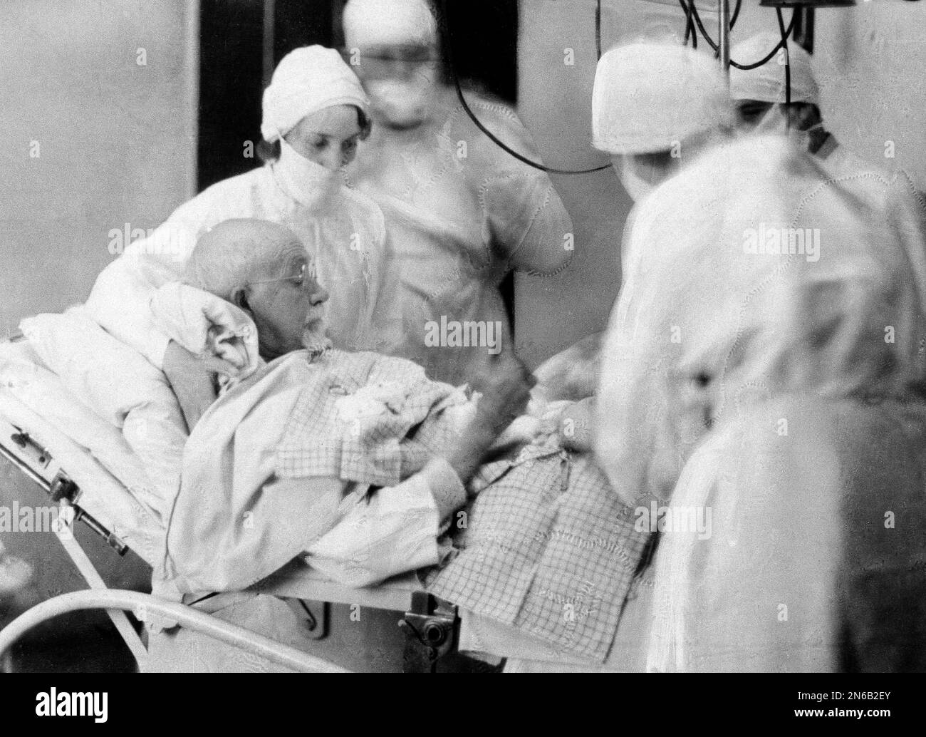 Dr. Evan O'Neill Kane, surgeon, as he operates on himself for a ...