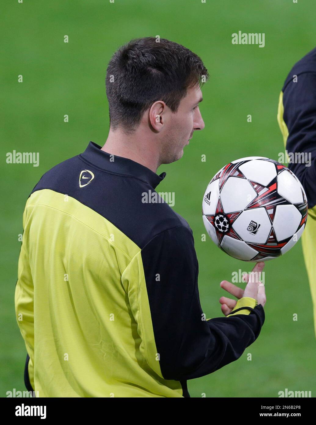 Barcelona's Lionel Messi, of Argentina, holds a ball on his thumb ...