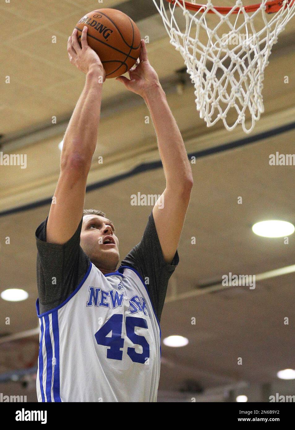 New York Knicks center Cole Aldrich (45) dunks during an NBA basketball ...