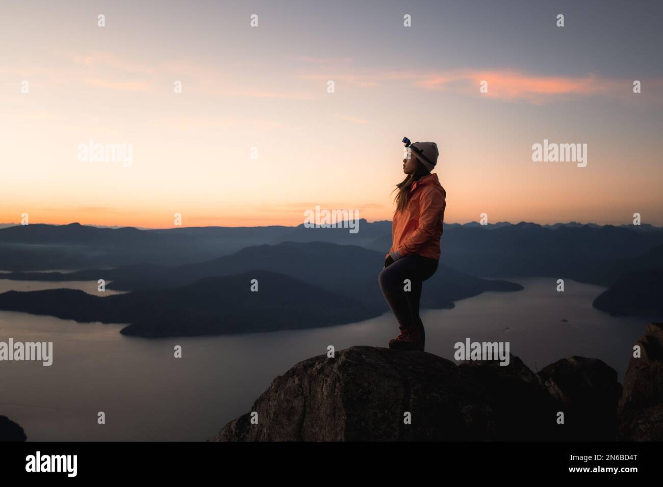 Beautiful woman standing on mountain hi-res stock photography and ...