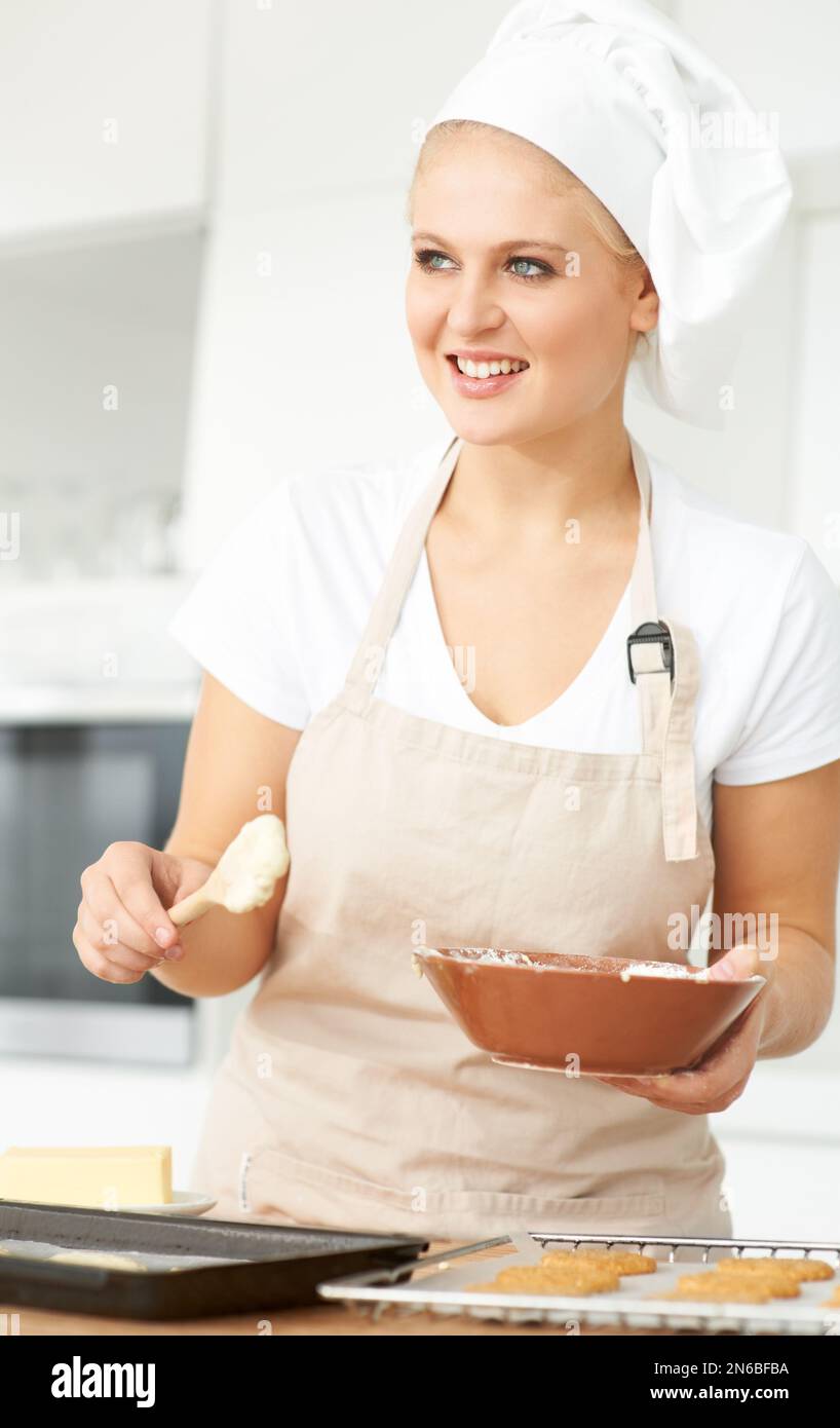 Thinking of how great these are going to taste. Beautiful young woman ...