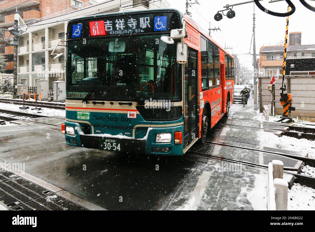 A bus runs under snowfall in Tokyo on February 10, 2023, in Japan. The ...