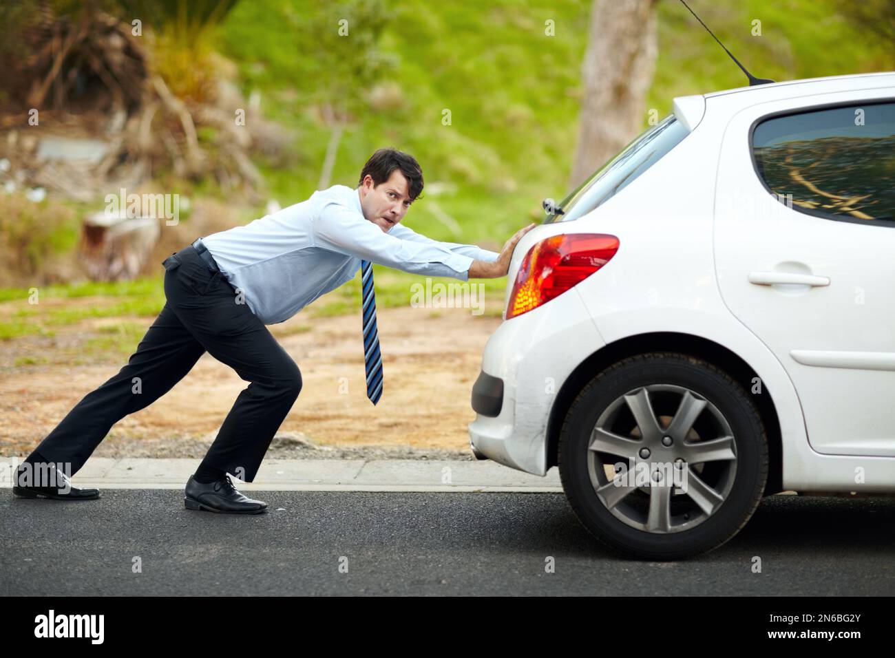 I hate having car trouble. Portrait of an unhappy man pushing his car ... I hate having car trouble. Portrait of an unhappy man pushing his car ...