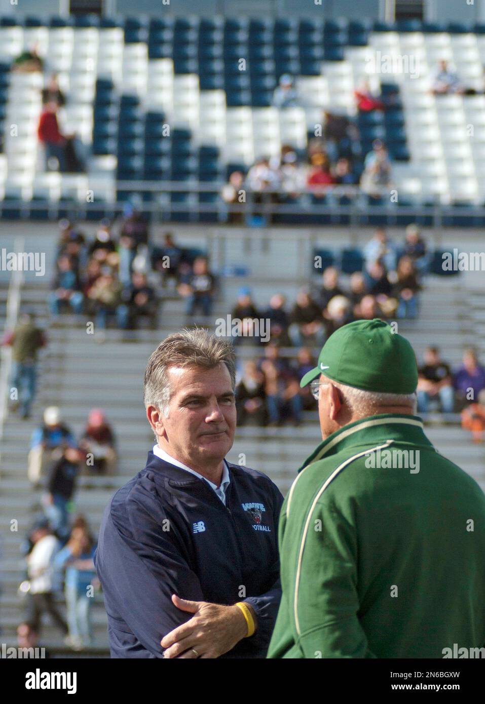 Maine coach Jack Cosgrove, left, talks with William and Mary football ...