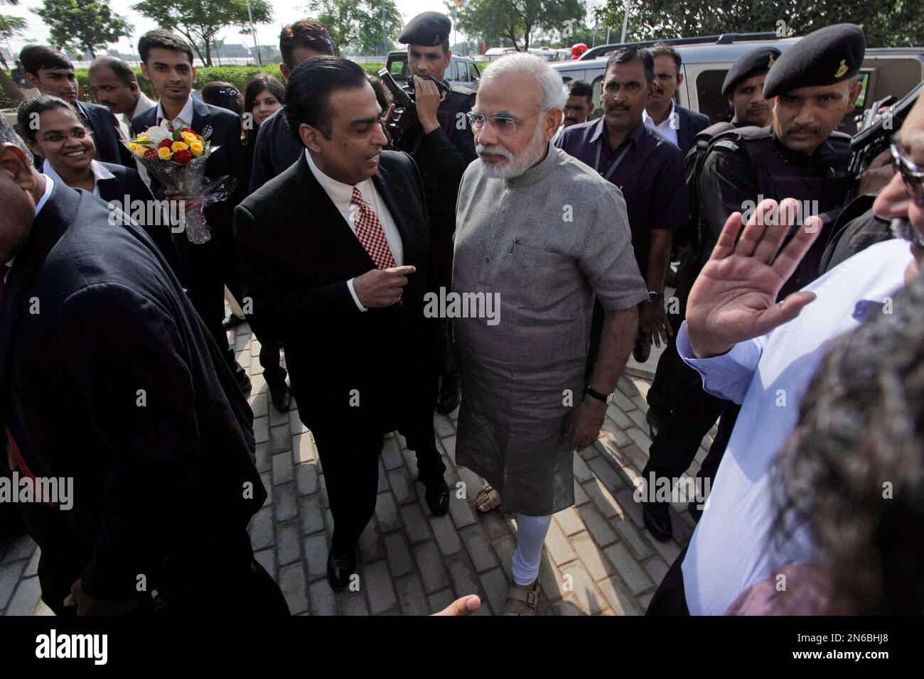Chairman and Managing Director of Reliance Industries Limited Mukesh Ambani, center left, speaks ...