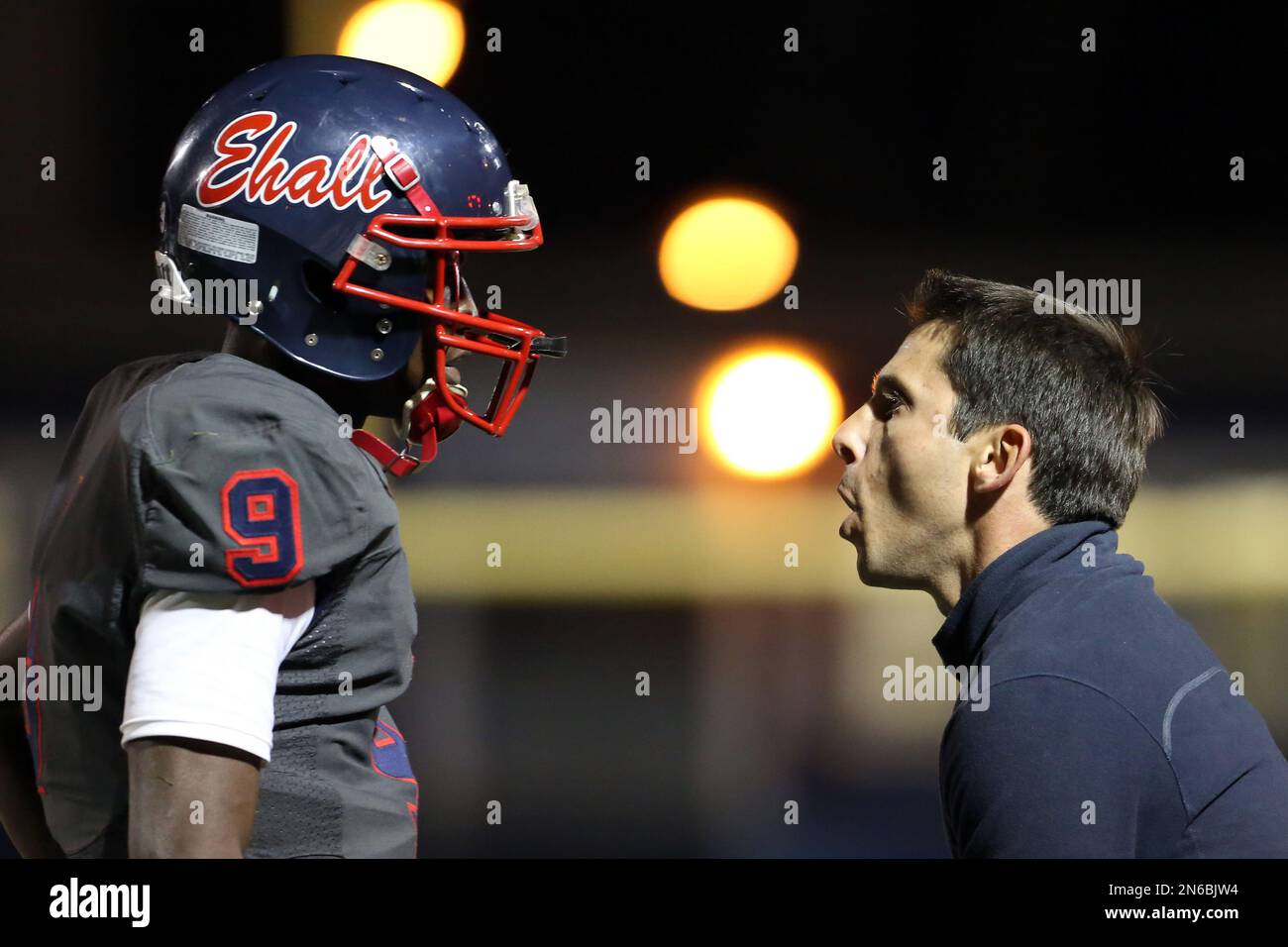 Erasmus Hall Flying Dutchmen QB Daiquan Gwyn #9 has a discussion with ...