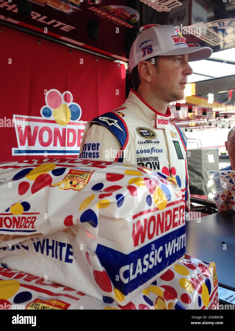 Kurt Busch stands next to his hauler as he prepares for practice for ...