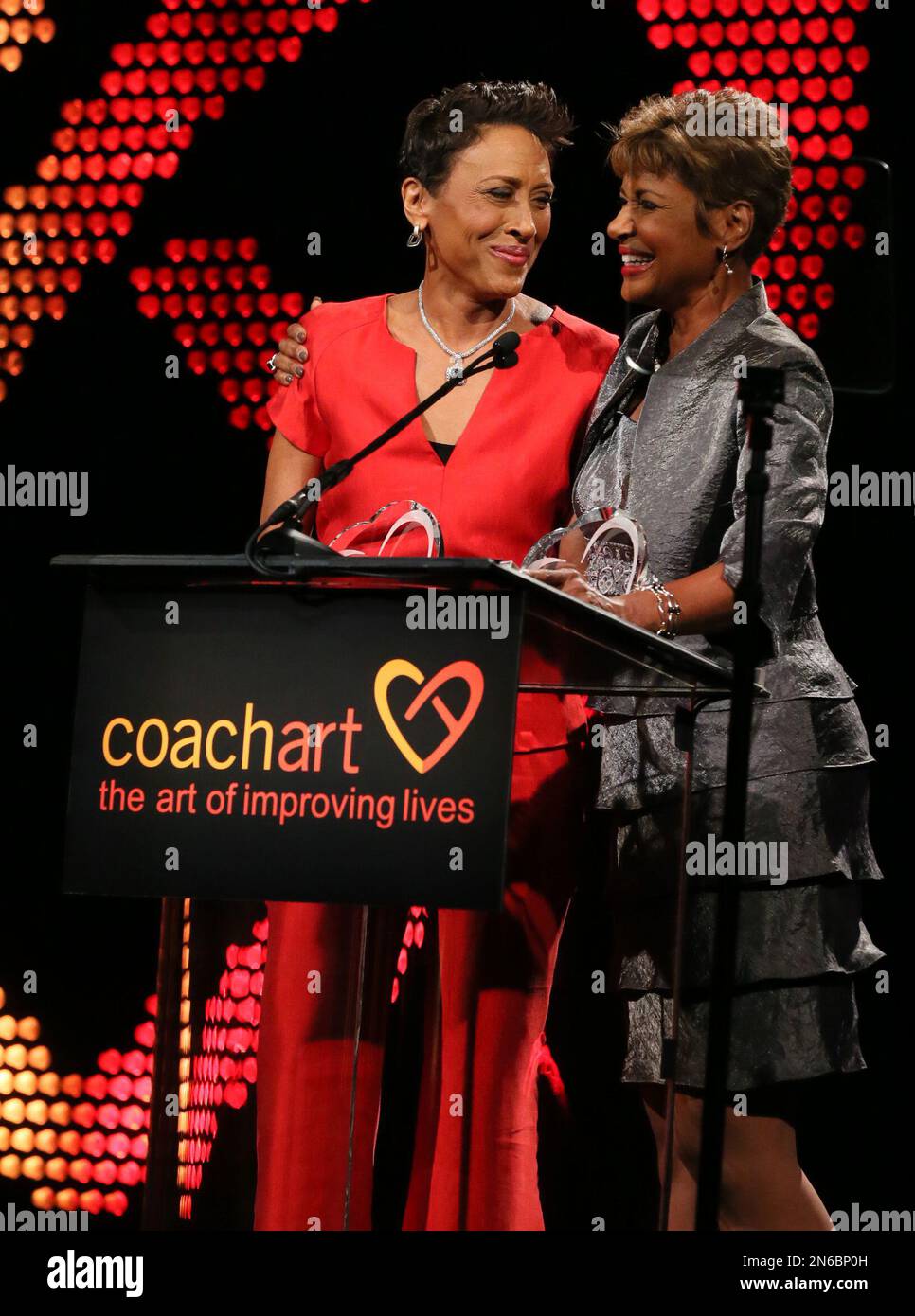 Robin Roberts, left, and Sally-Ann Roberts are honored at the CoachArt ...